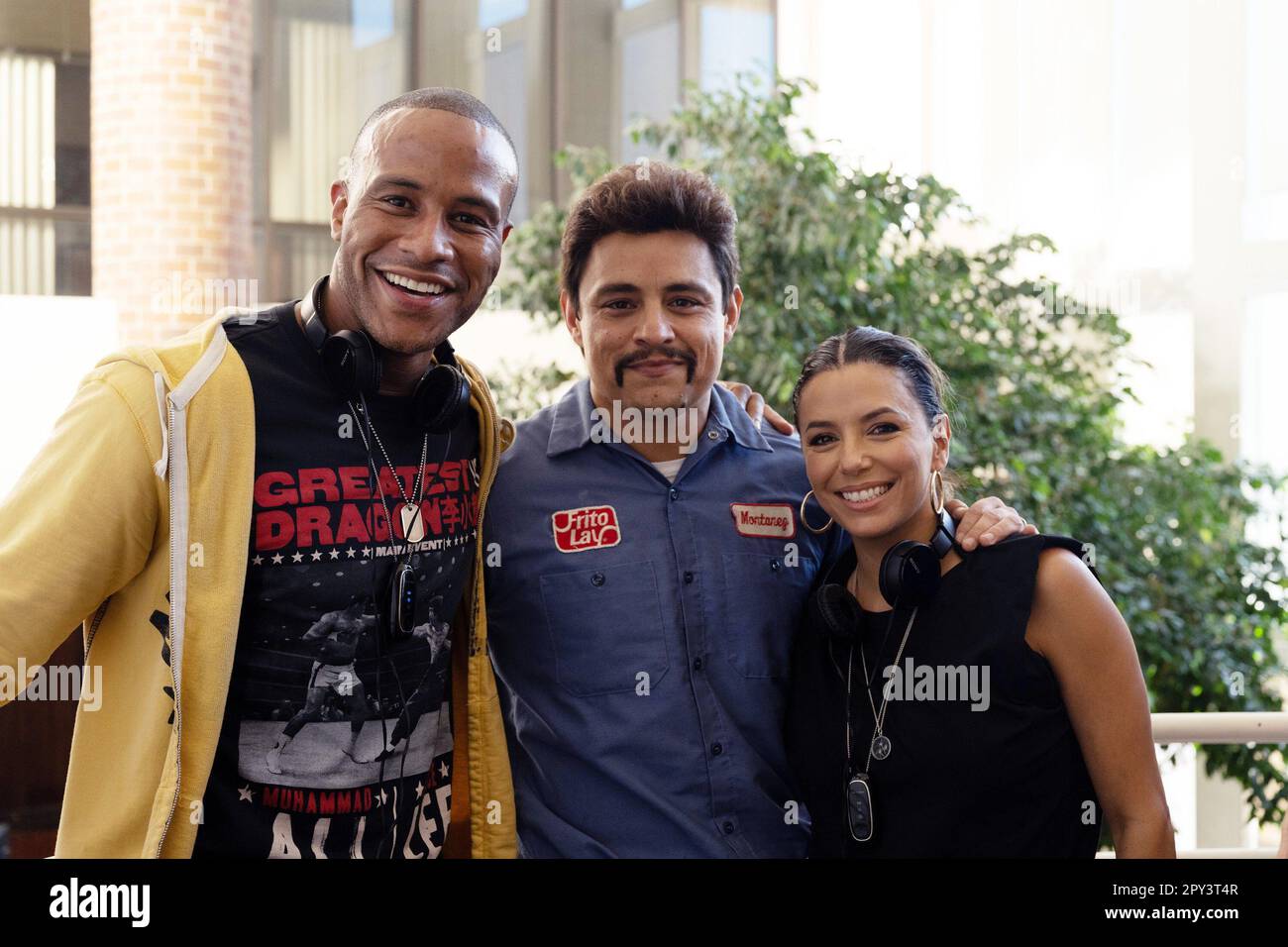 FLAMIN' HOT, from left: DeVon Franklin, Jesse Garcia, director Eva Longoria, on set, 2023. ph ...