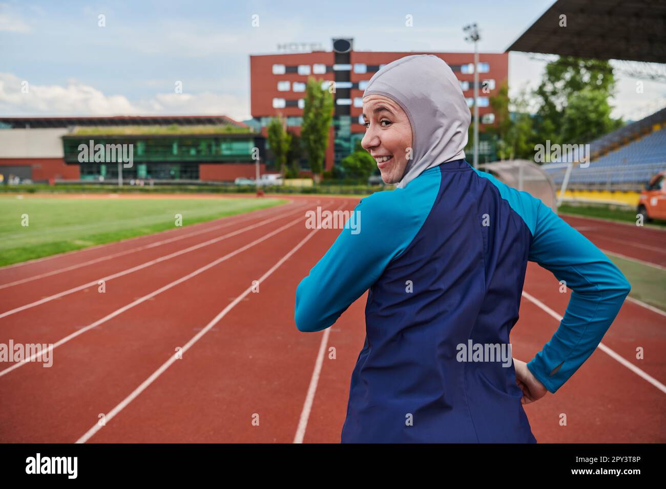 A muslim woman in a burqa sports muslim clothes running on a marathon ...