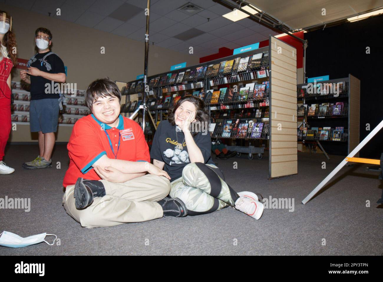 I LIKE MOVIES, sitting, from left: Isaiah Lehtinen, director Chandler Levack, on set, 2022 ...