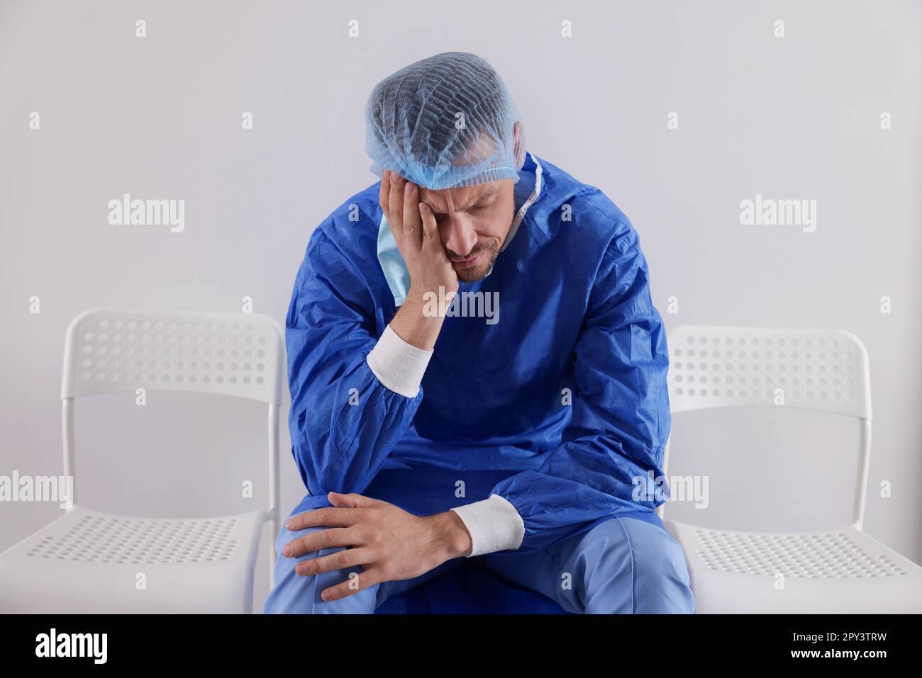 Doctor sitting on chair hi-res stock photography and images - Alamy