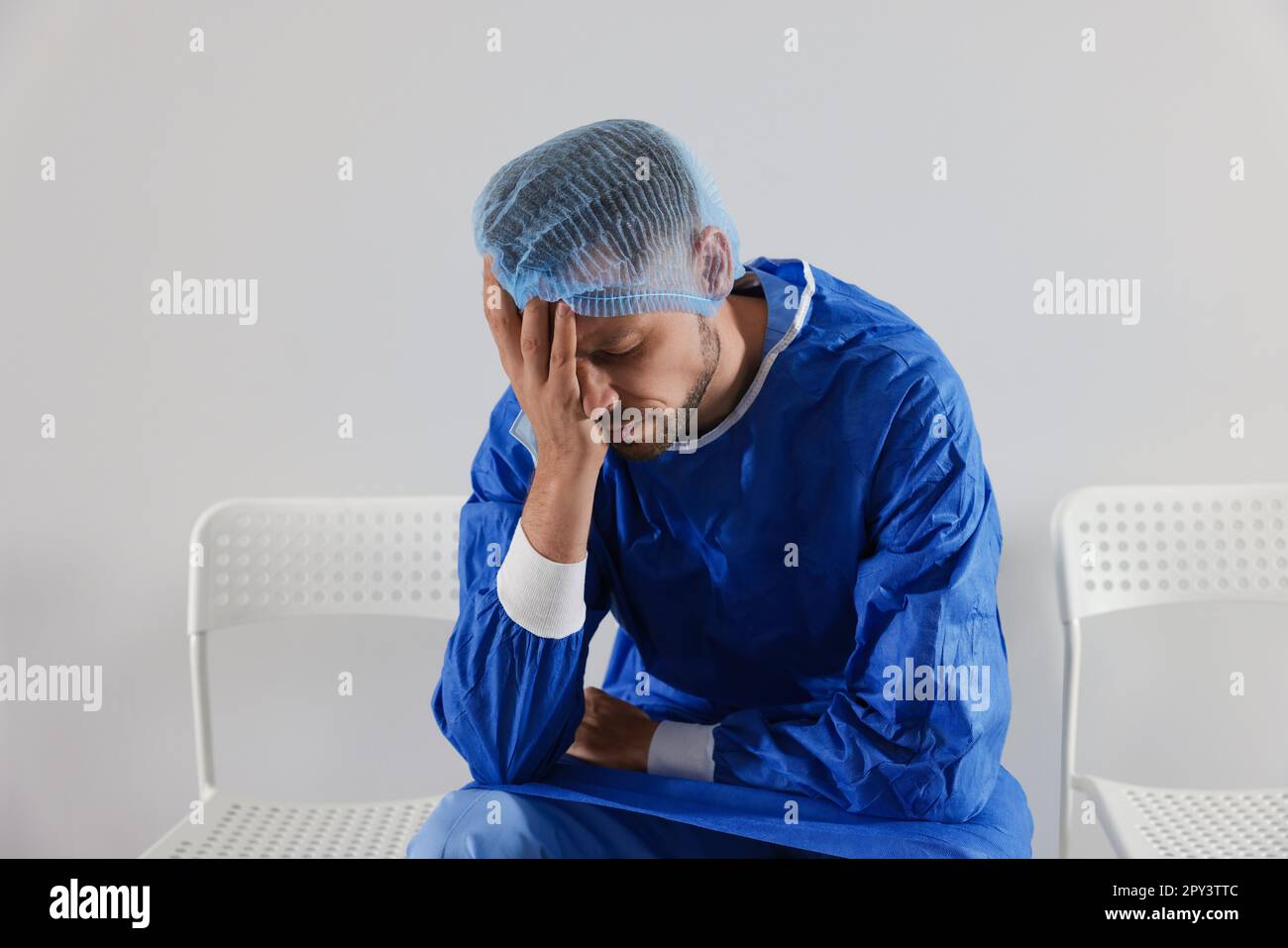 Doctor sitting on chair hi-res stock photography and images - Alamy