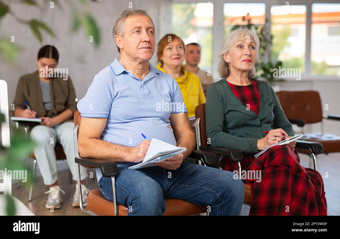 Elderly people study in classroom on refresher courses Stock Photo - Alamy