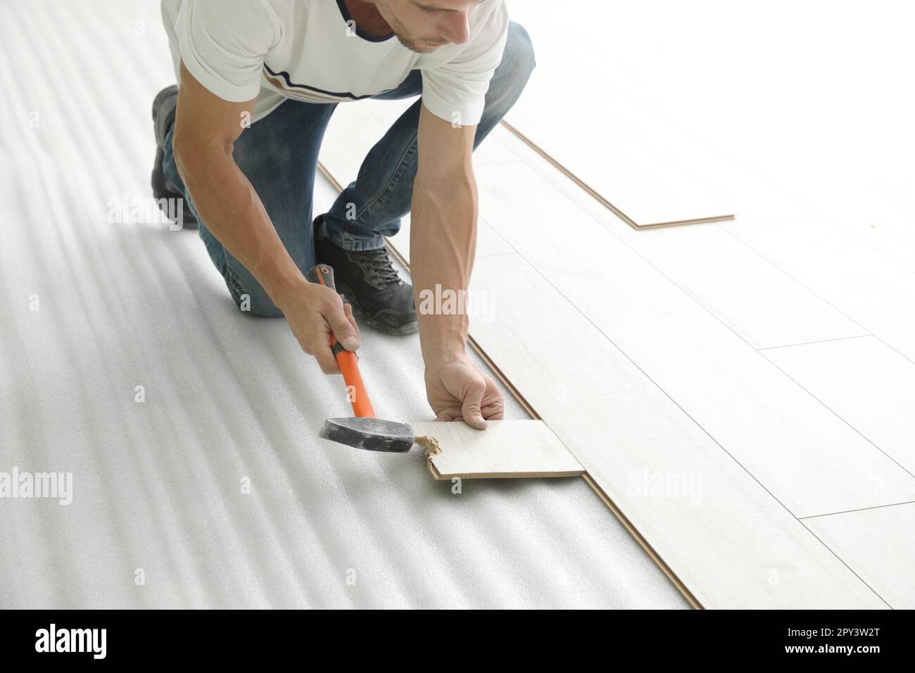 Carpenter during installing laminate hi-res stock photography and ...