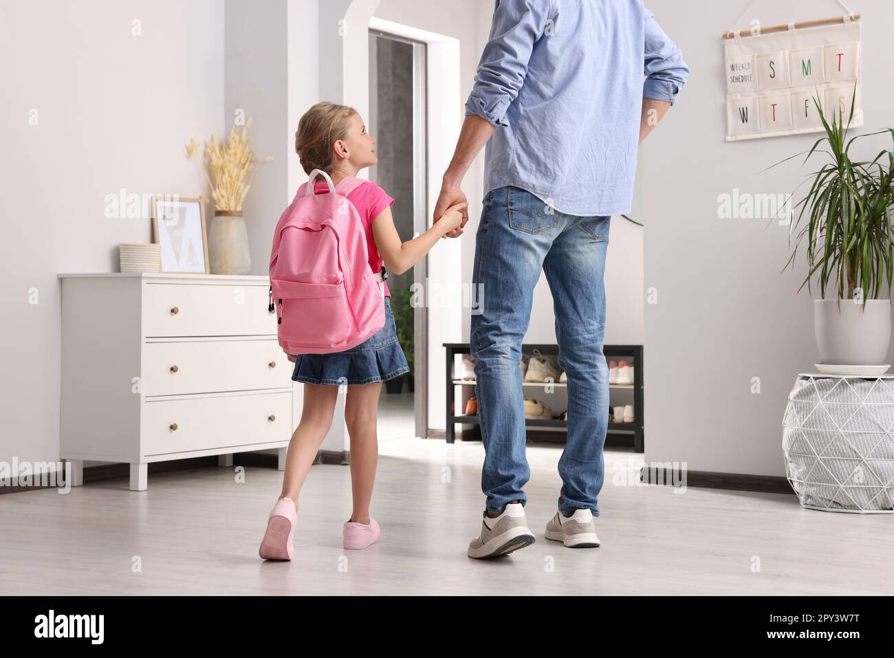Little girl with father at home. Ready to go to school Stock Photo - Alamy
