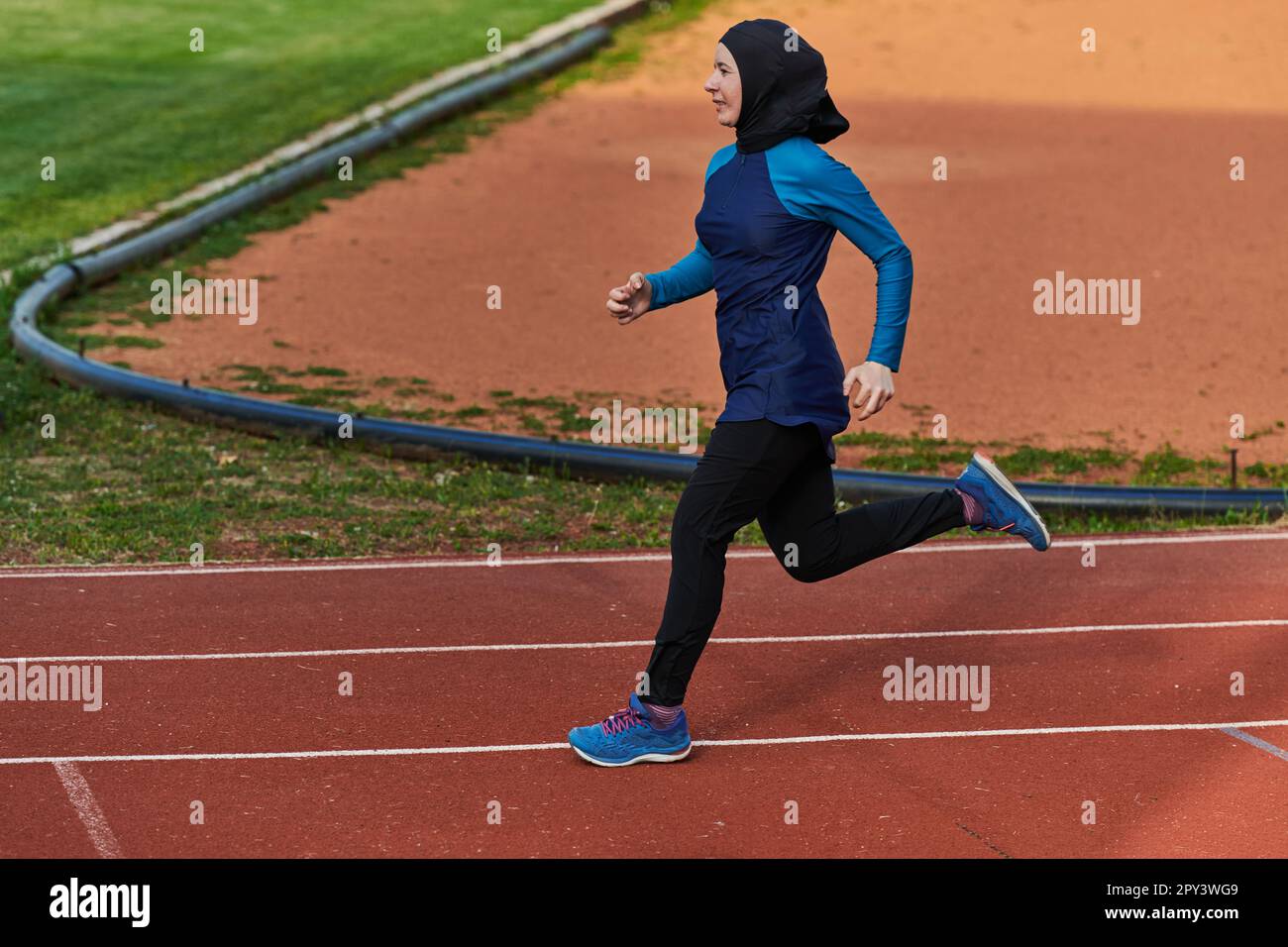 A muslim woman in a burqa sports muslim clothes running on a marathon ...