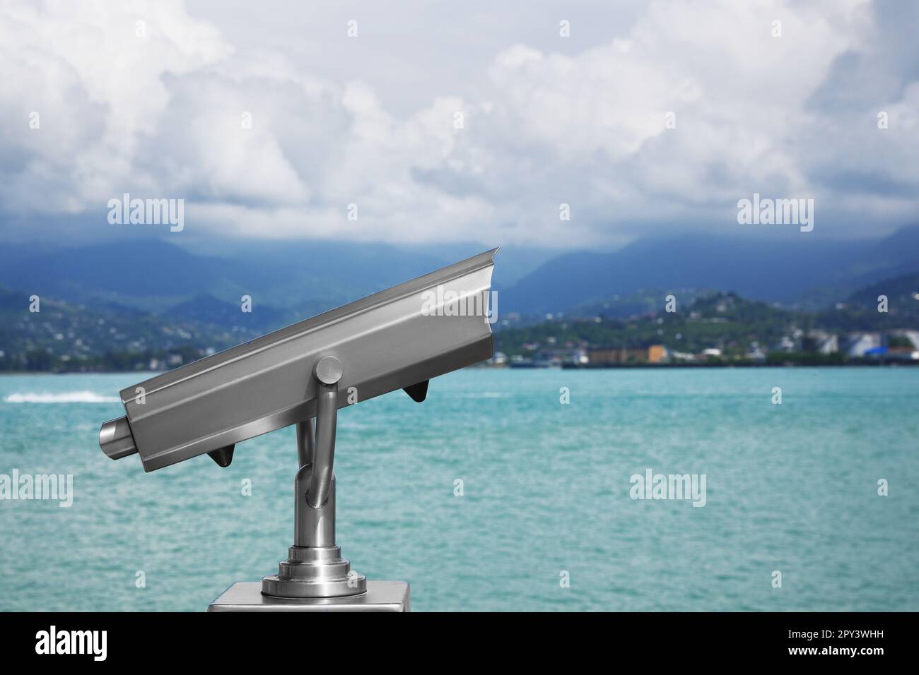 Metal tower viewer installed near sea, space for text. Mounted ...