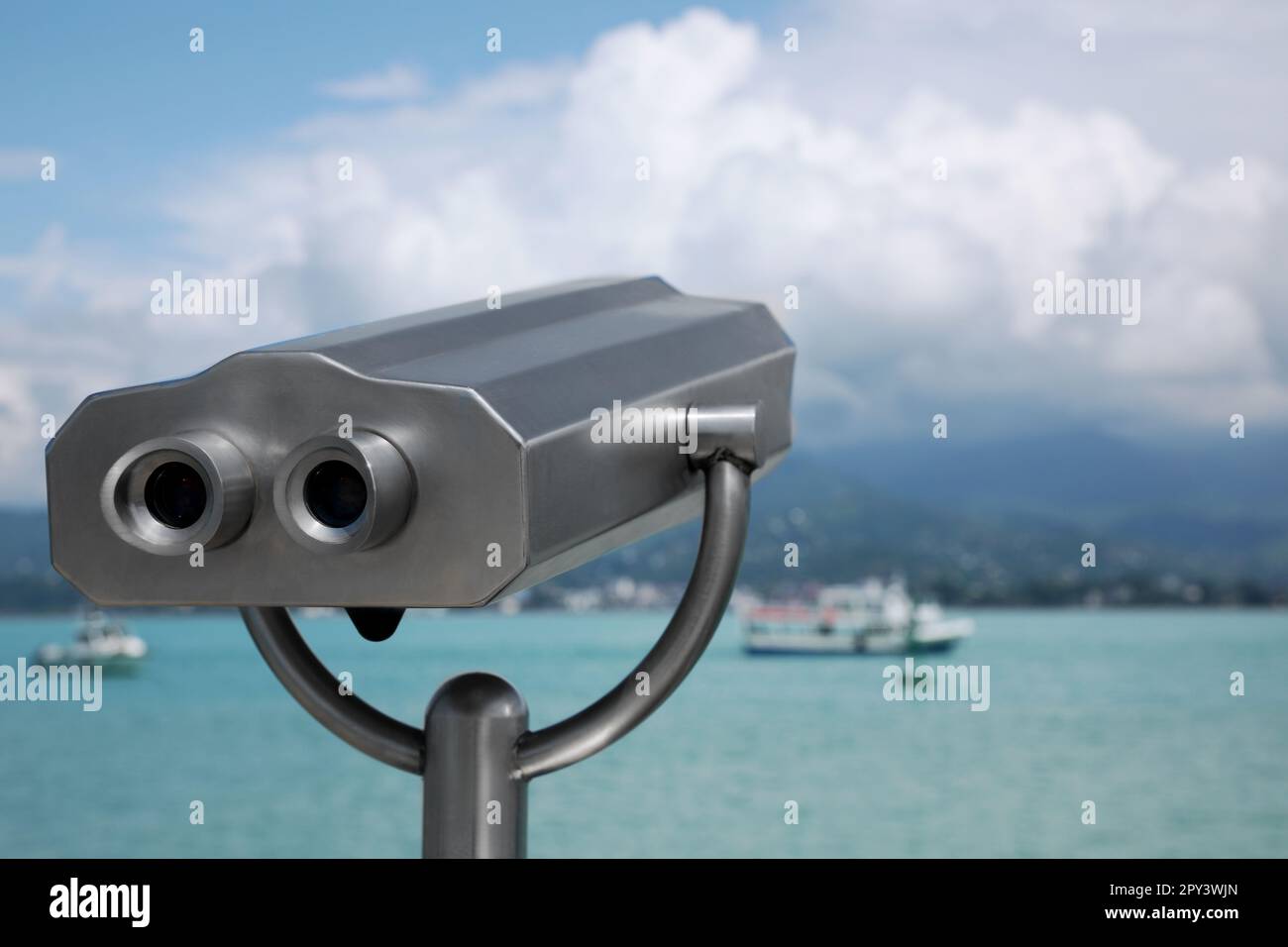 Metal tower viewer installed near sea, space for text. Mounted ...