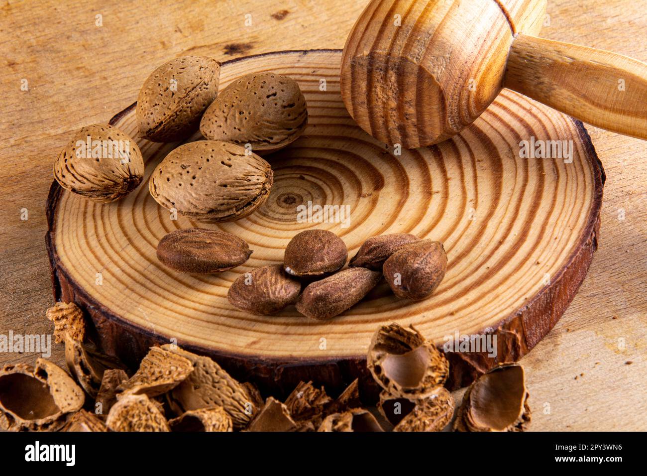 Starting almonds on a wood, with a mace wood. Warm and rustic ...