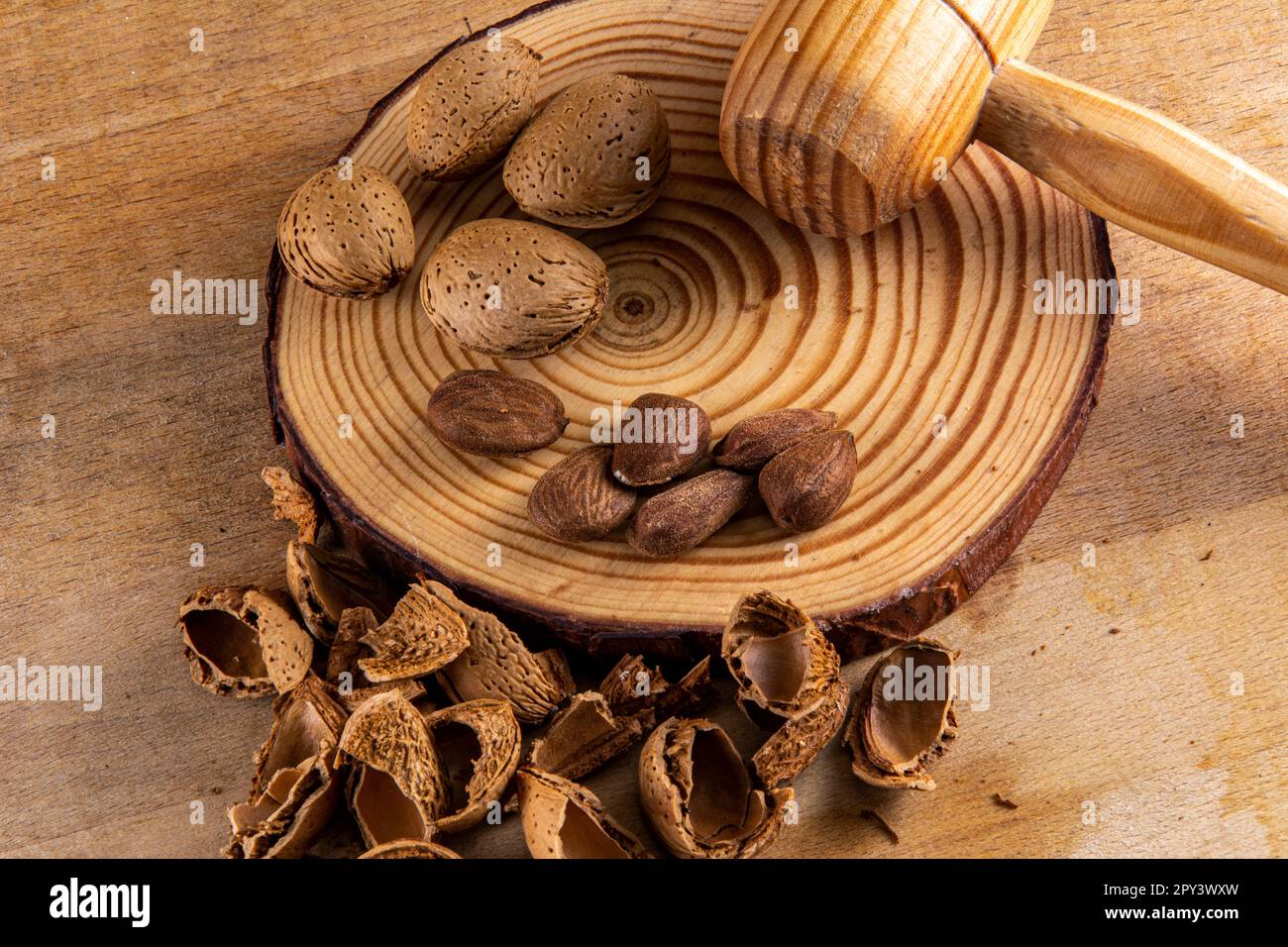 Starting almonds on a wood, with a mace wood. Warm and rustic ...