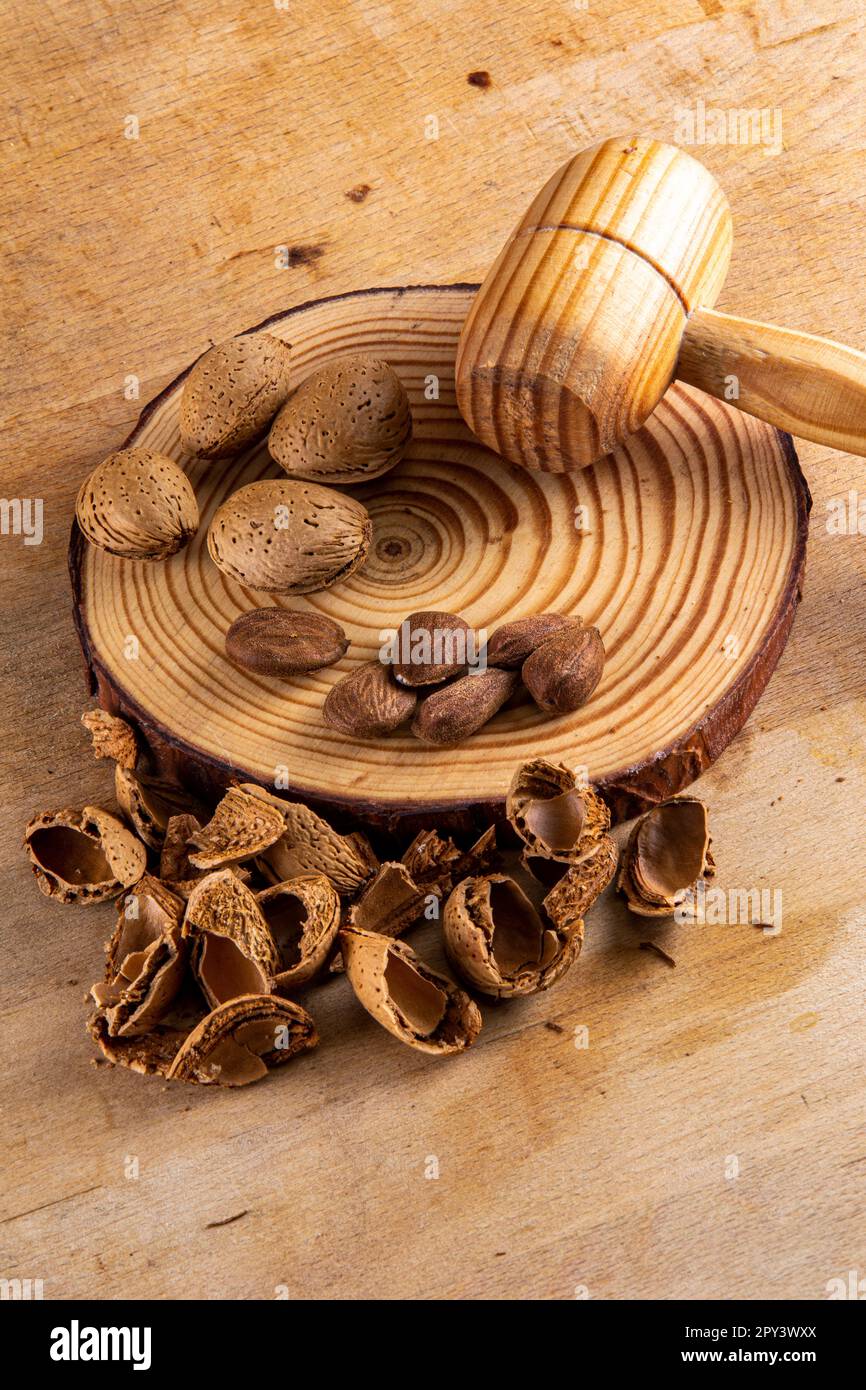 Starting almonds on a wood, with a mace wood. Warm and rustic ...