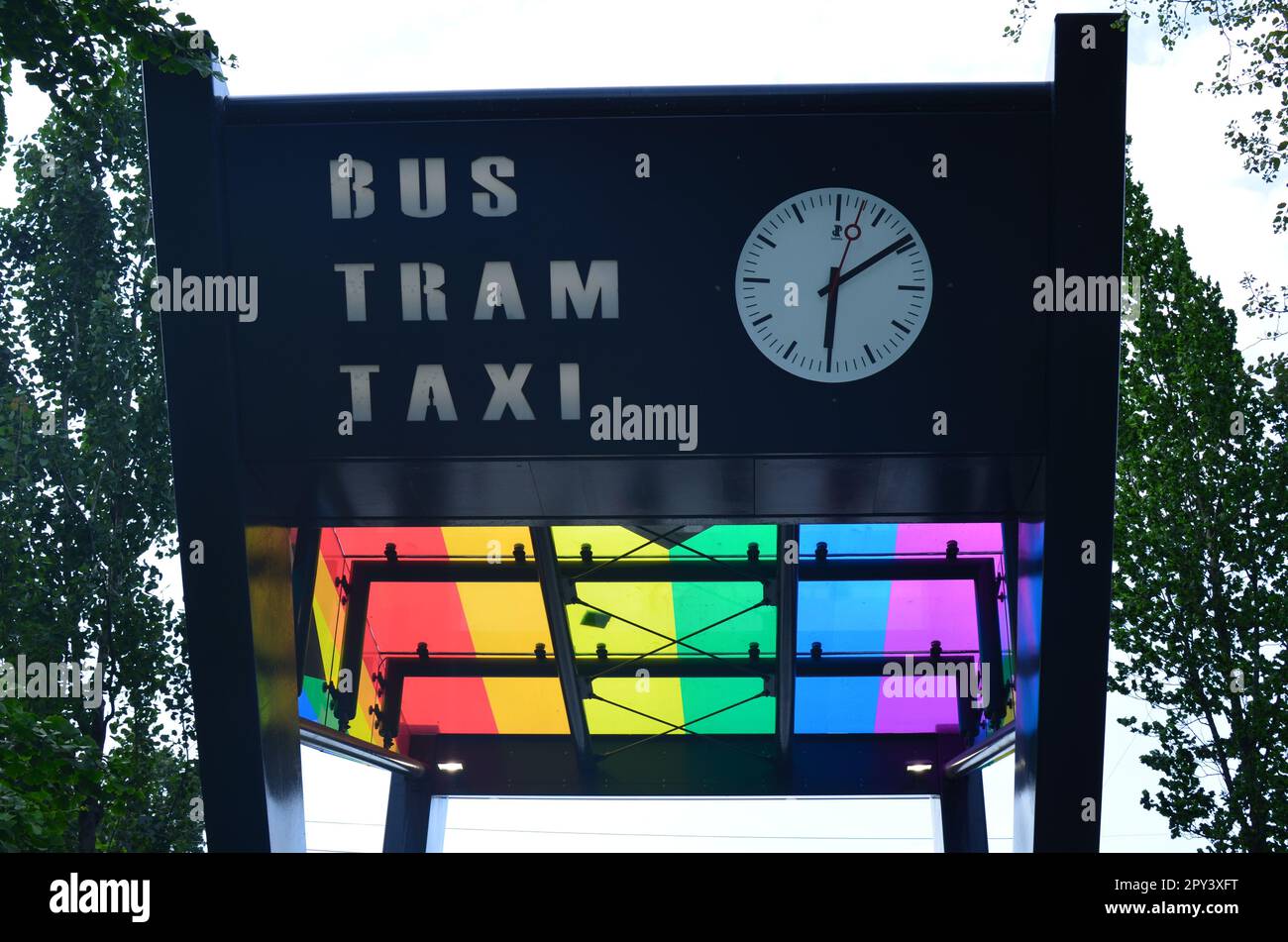 Bus, taxi and tram station with rainbow flag outdoors Stock Photo - Alamy