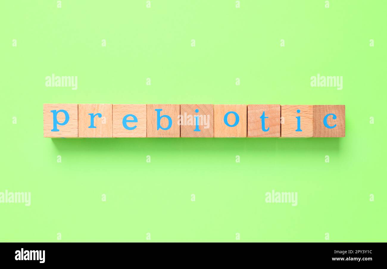 Word Prebiotic made of cubes with letters on light green background ...