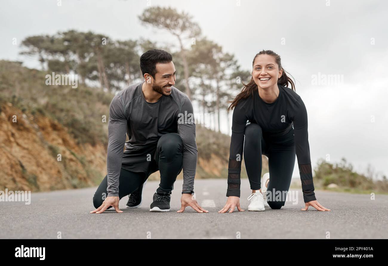 First one to the top of the hill wins. Full length shot of two young ...