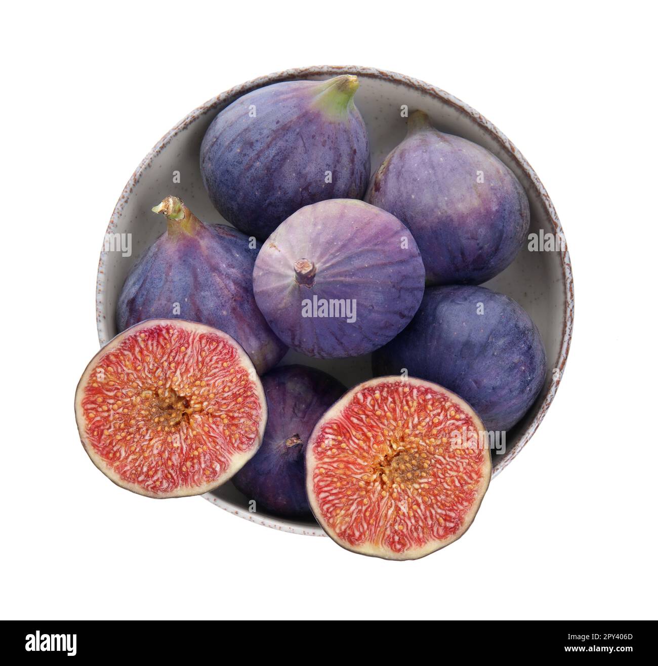 Whole and cut fresh purple figs in bowl isolated on white, top view ...