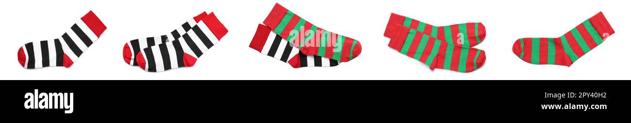 Set with pairs of striped socks on white background, top view. Banner ...