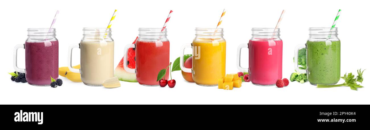 Set with different delicious smoothies in mason jars on white ...
