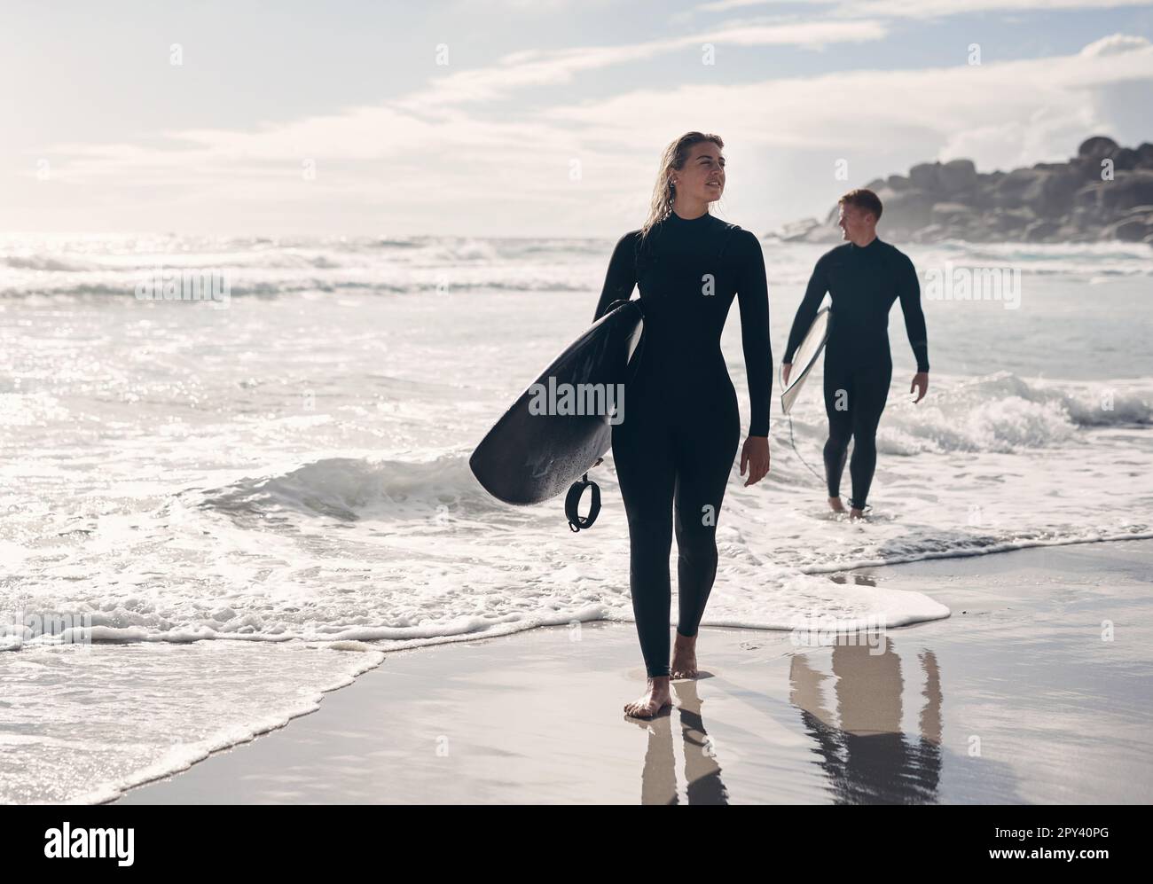 Grab your surfboard and let the adventure begin. a young couple out ...