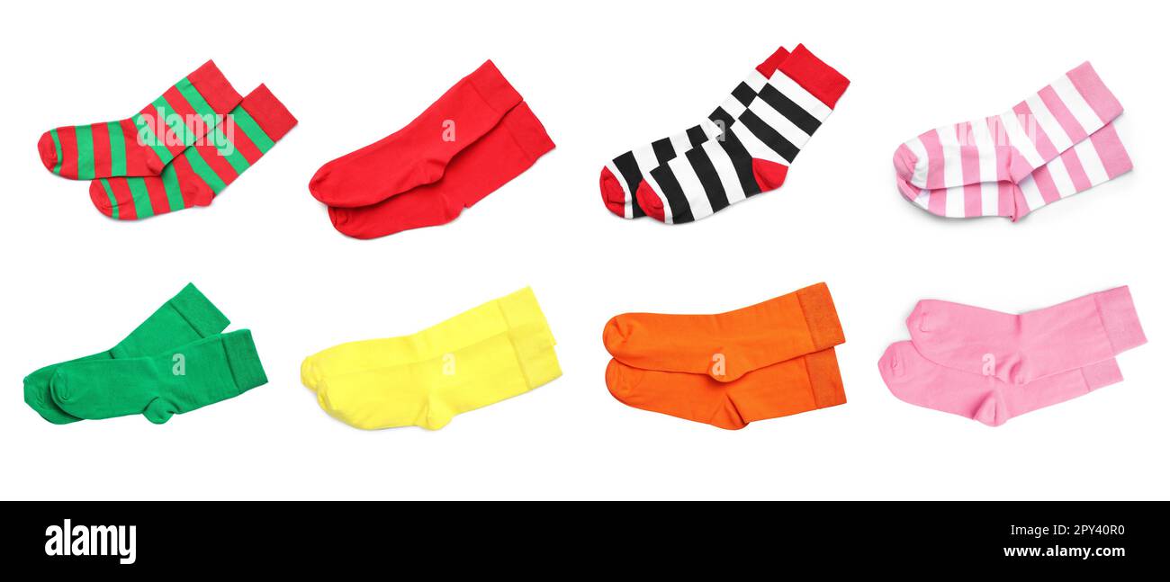 Set with pairs of different color socks on white background, top view ...