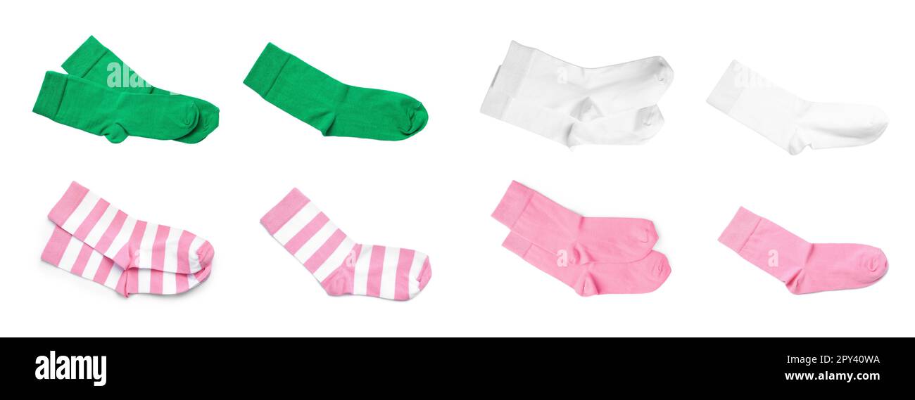 Set with pairs of different color socks on white background, top view ...