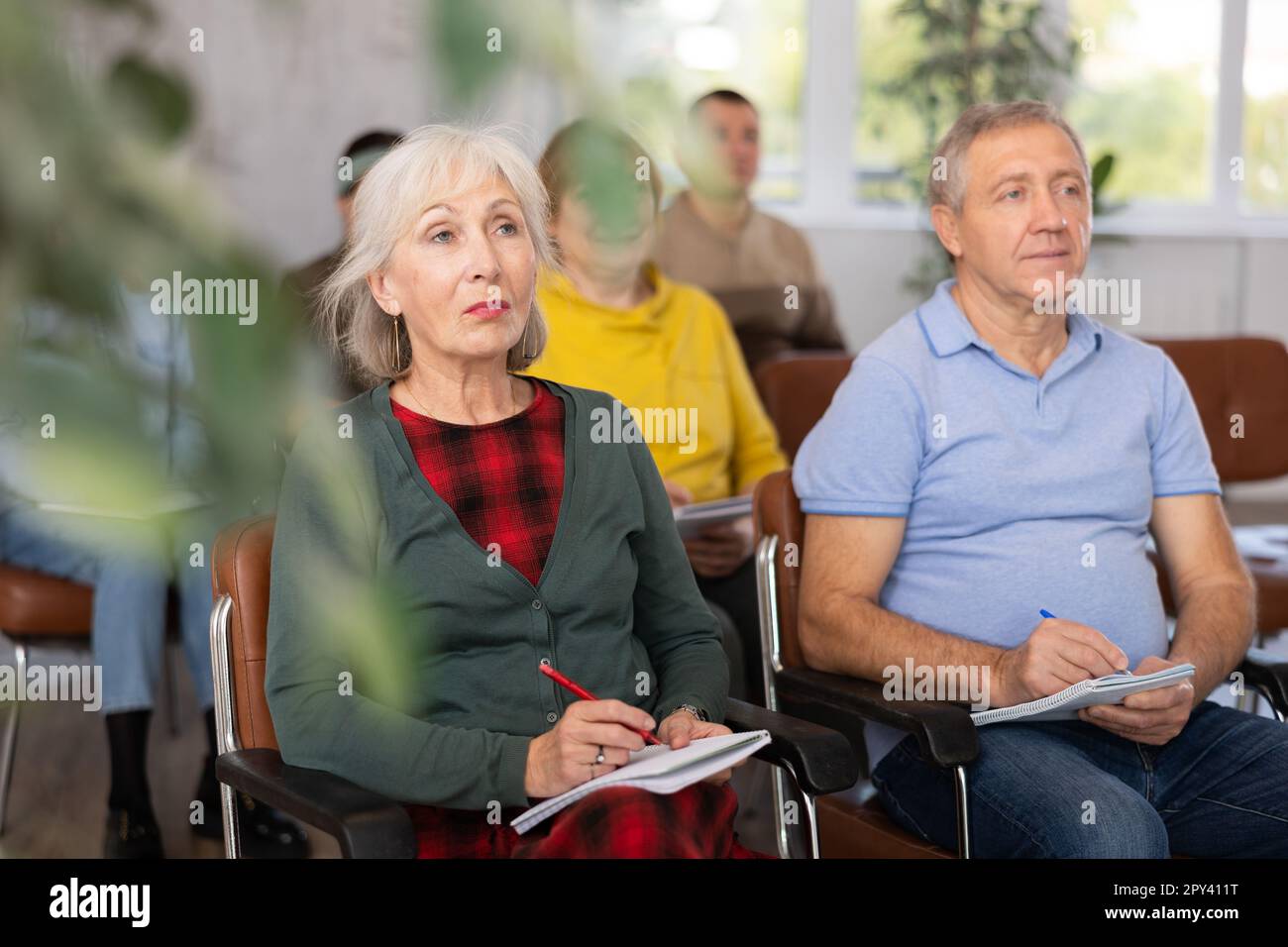 Elderly people study in classroom on refresher courses Stock Photo - Alamy