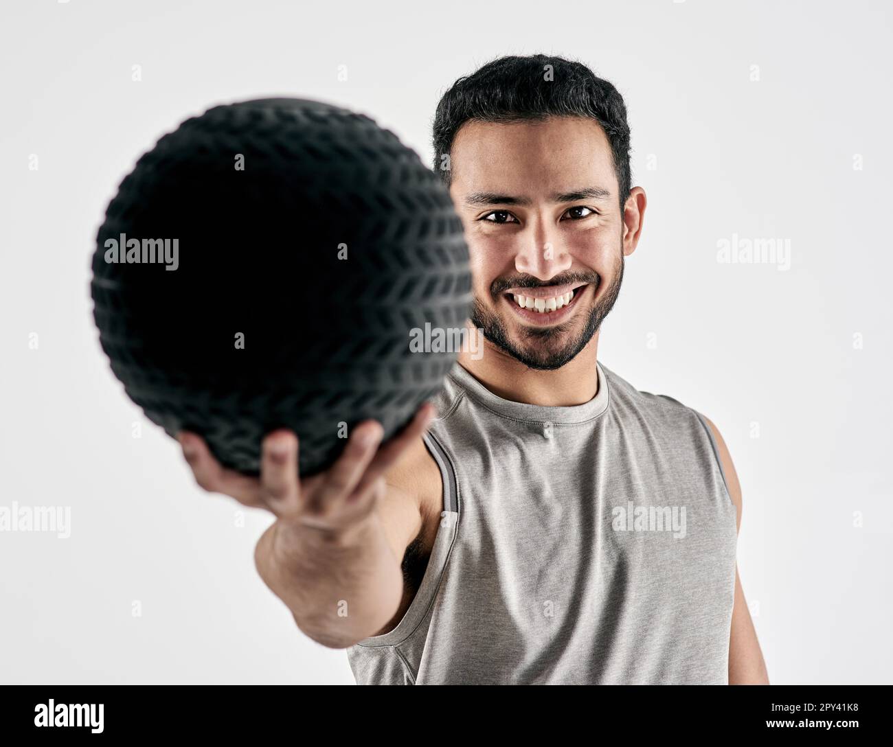 Care to make some muscles with me. Studio portrait of a muscular young ...