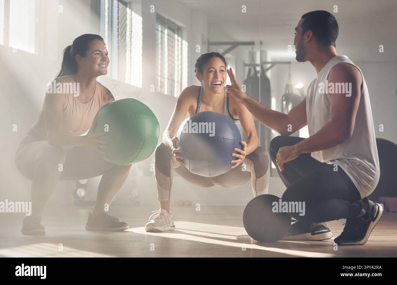 Its a lot easier than you think. two women using fitness balls while ...