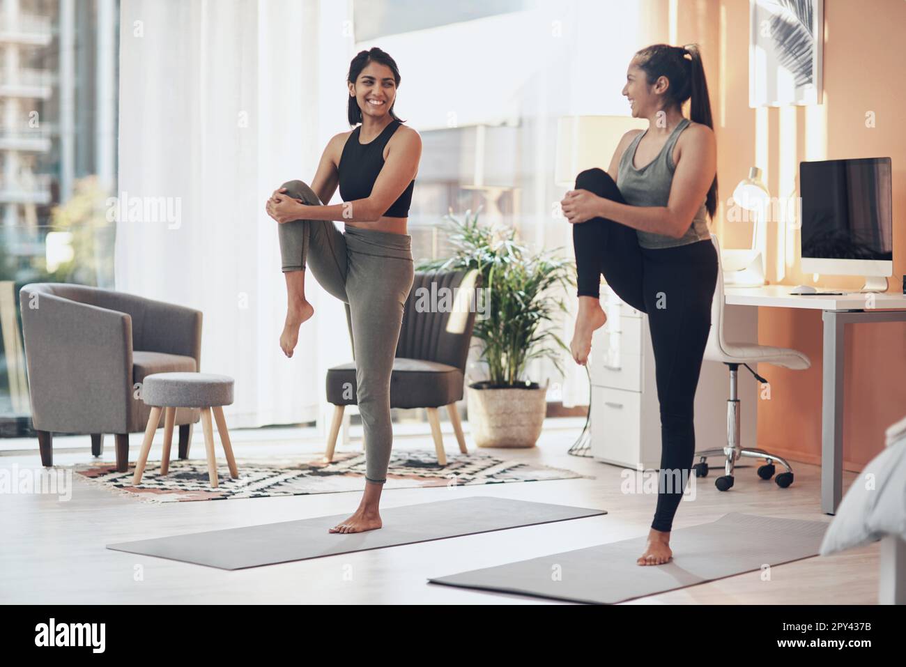 Healthy habits Happy bodies. two beautiful young women exercising ...