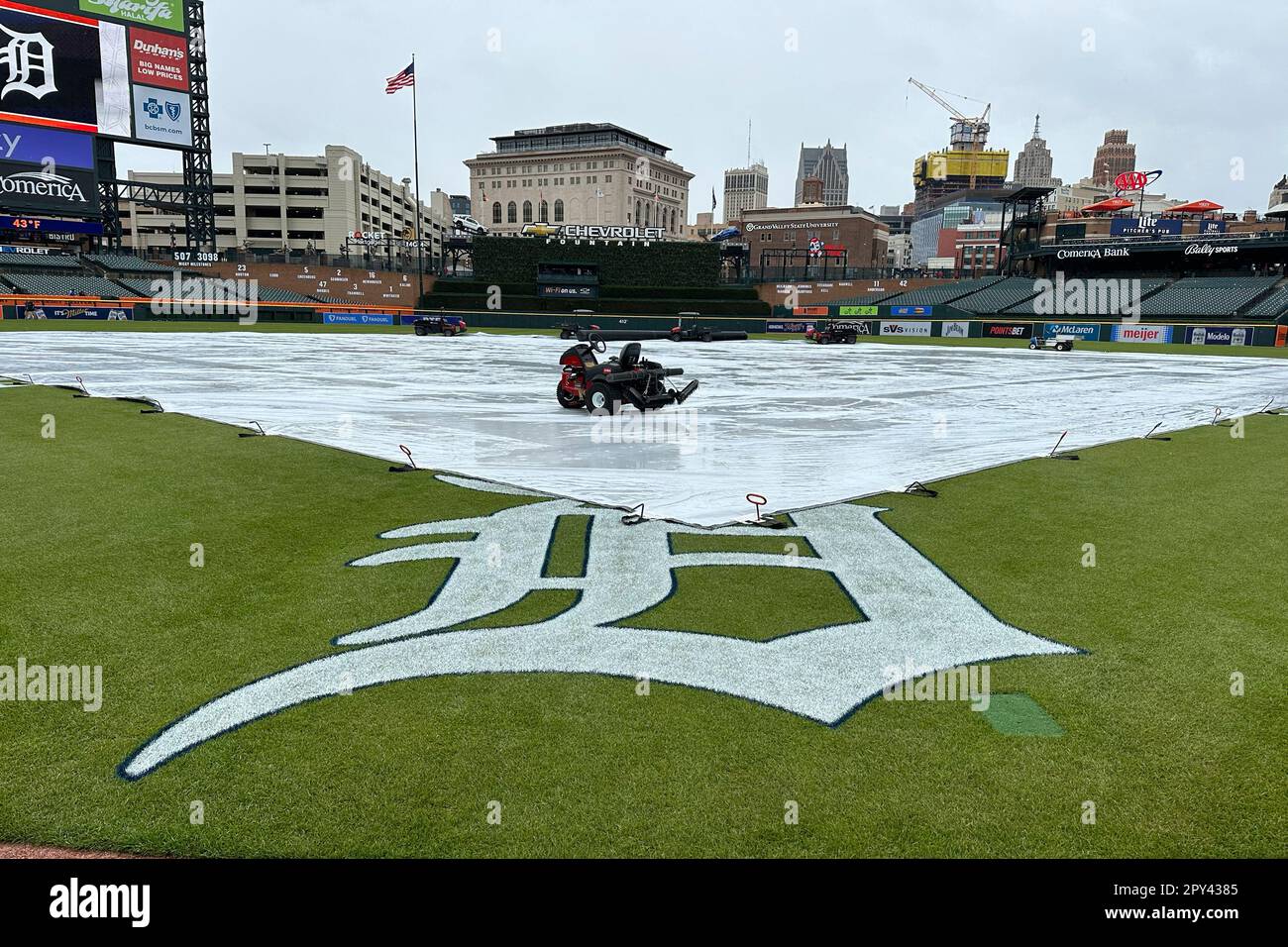 A tarp covers the Comerica Park field before a baseball game between ...