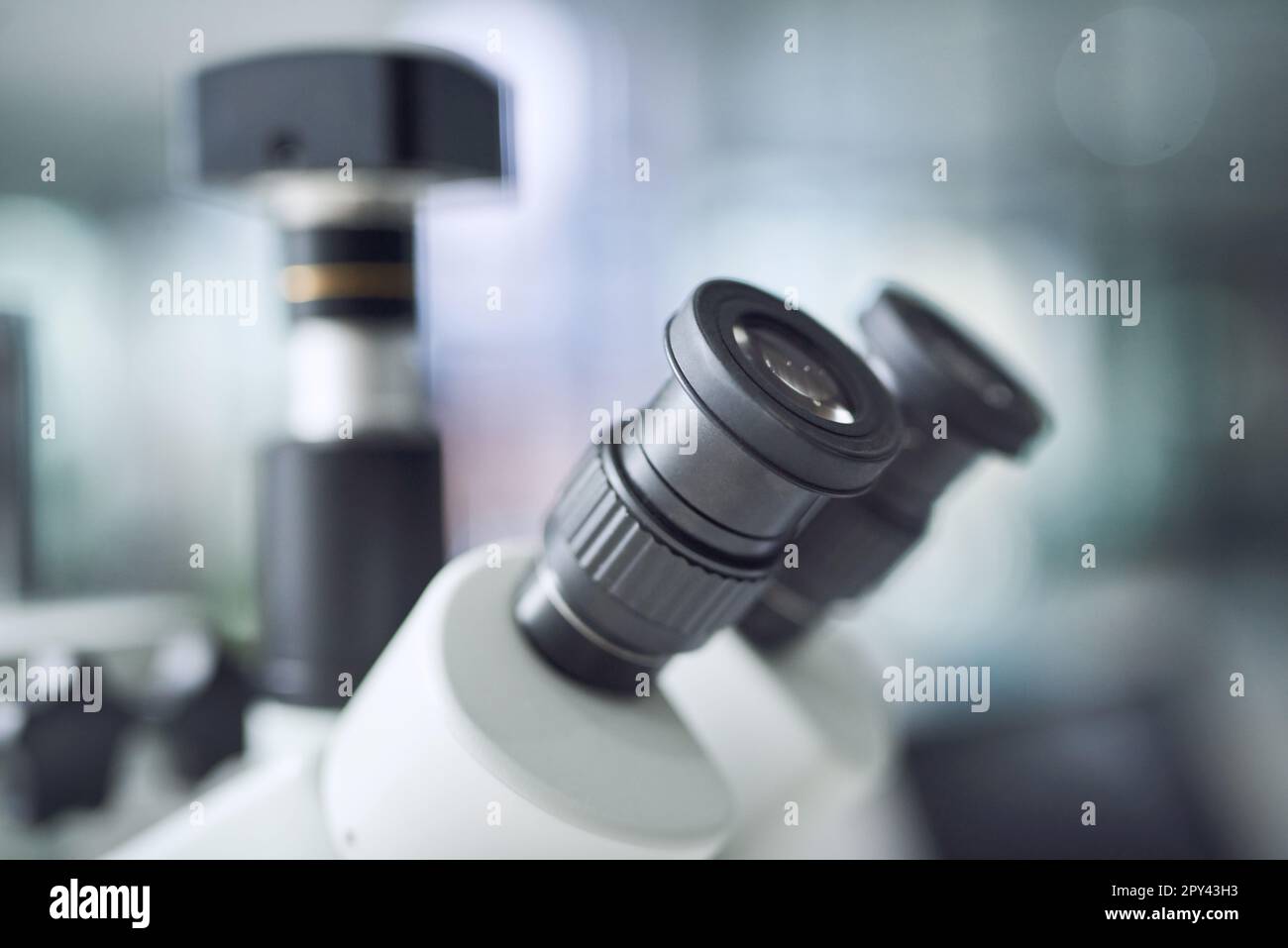 You cant escape my eyes. a microscope in a modern laboratory Stock ...