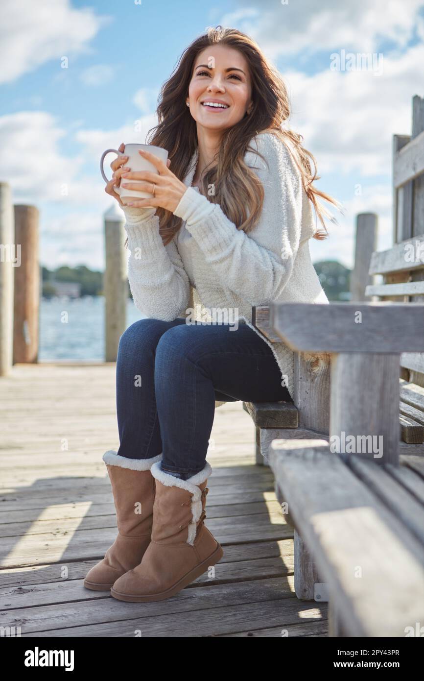 I feel fall in the air. a beautiful young woman enjoying a warm ...