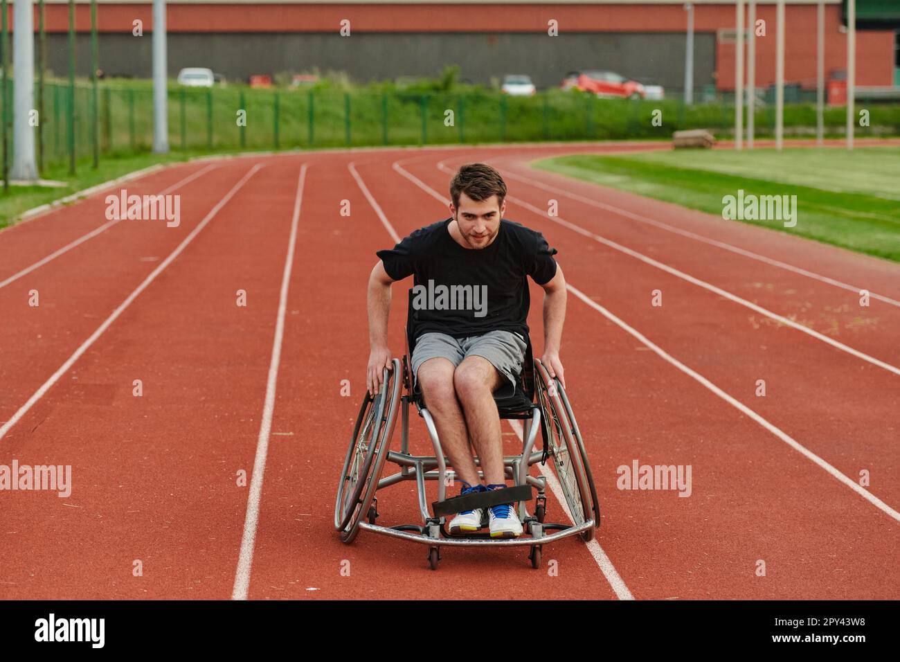 A person with disability in a wheelchair training tirelessly on the ...
