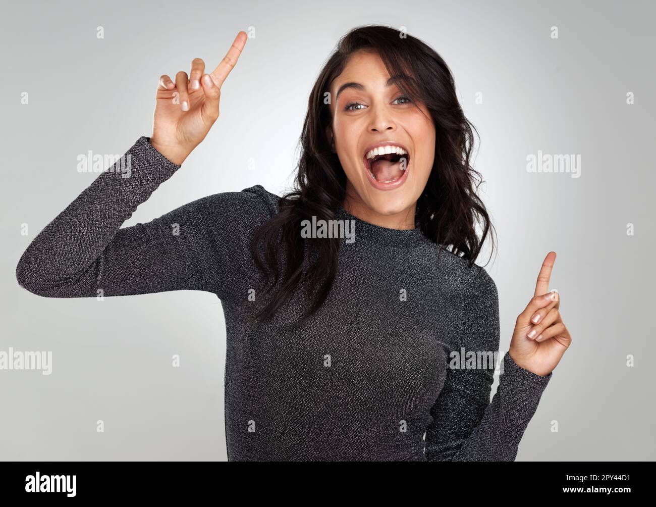 Guess who just got lucky. a young woman looking cheerful while standing ...
