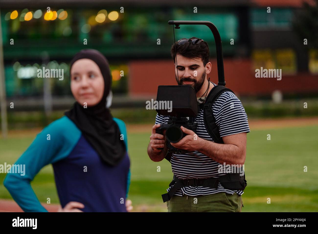 A cameraman filming the participants of the Paralympic race on the ...