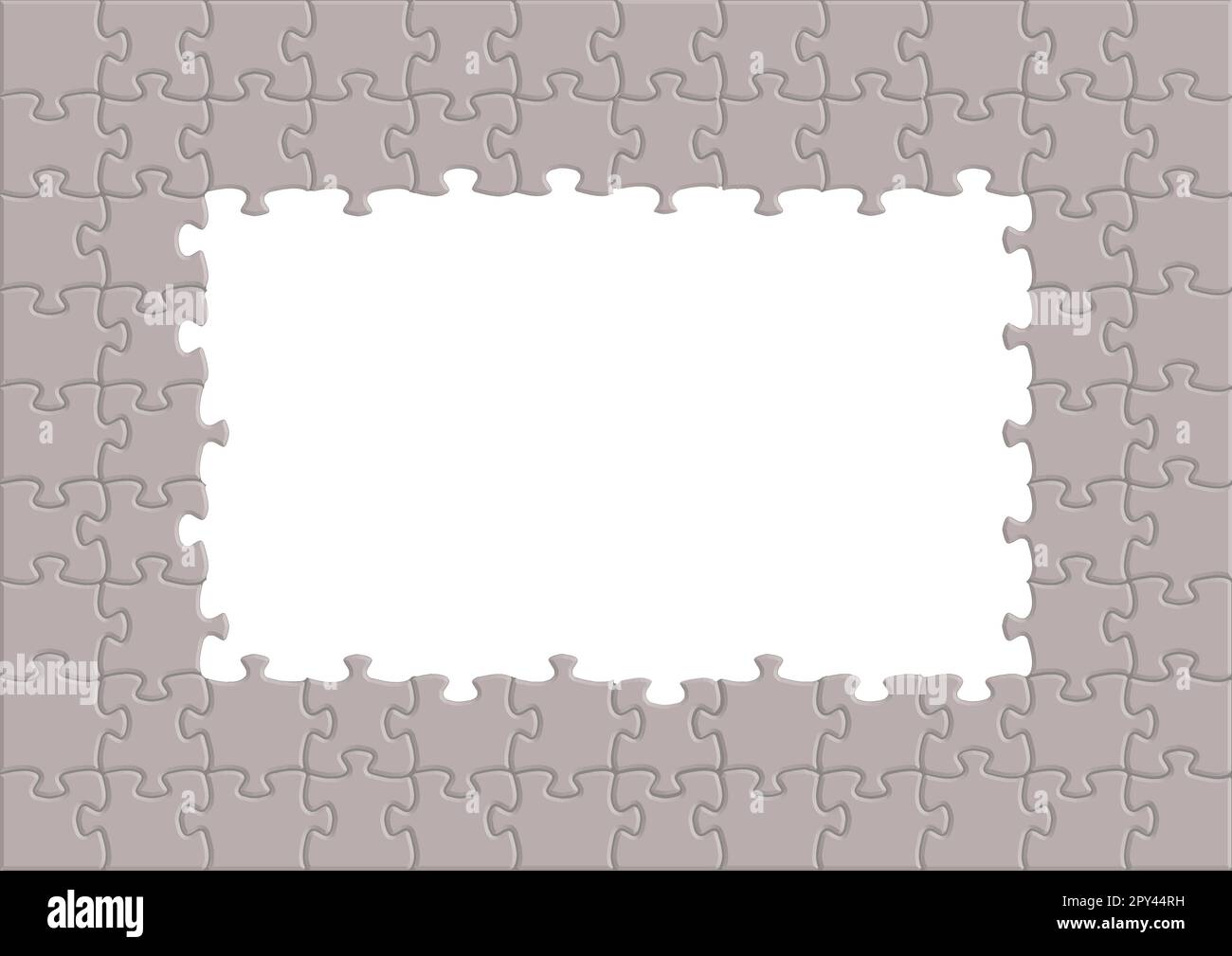 A jigsaw puzzle has an opening in the middle to create a frame for art ...