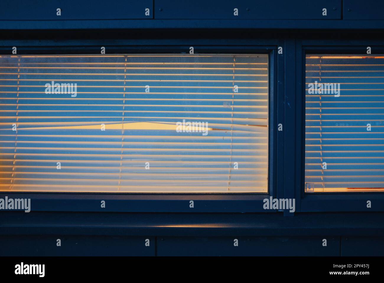 empty window with blinds and peephole at night Stock Photo - Alamy
