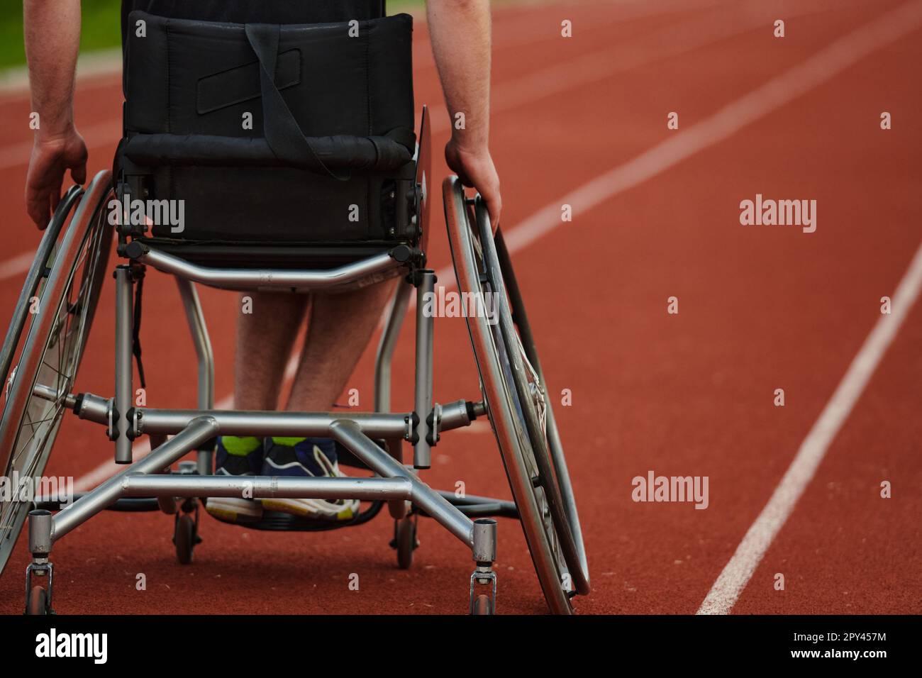 Close up photo of a person with disability in a wheelchair training ...