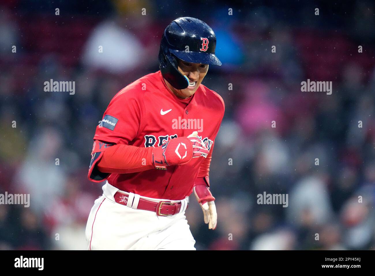 Boston Red Sox's Masataka Yoshida dashes down the first base line on a ground out during the ...