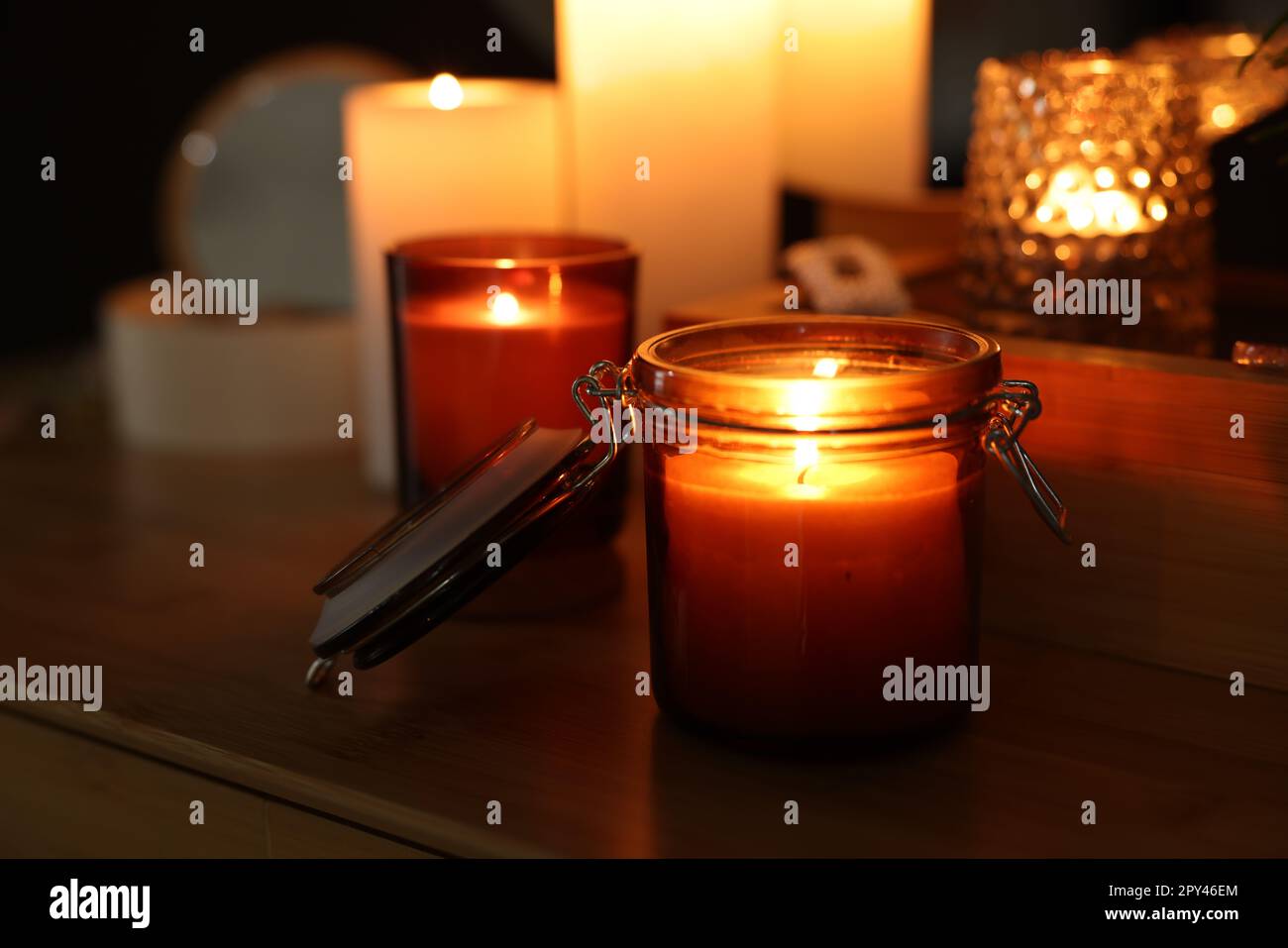 Lit candles in dark room hi-res stock photography and images - Alamy
