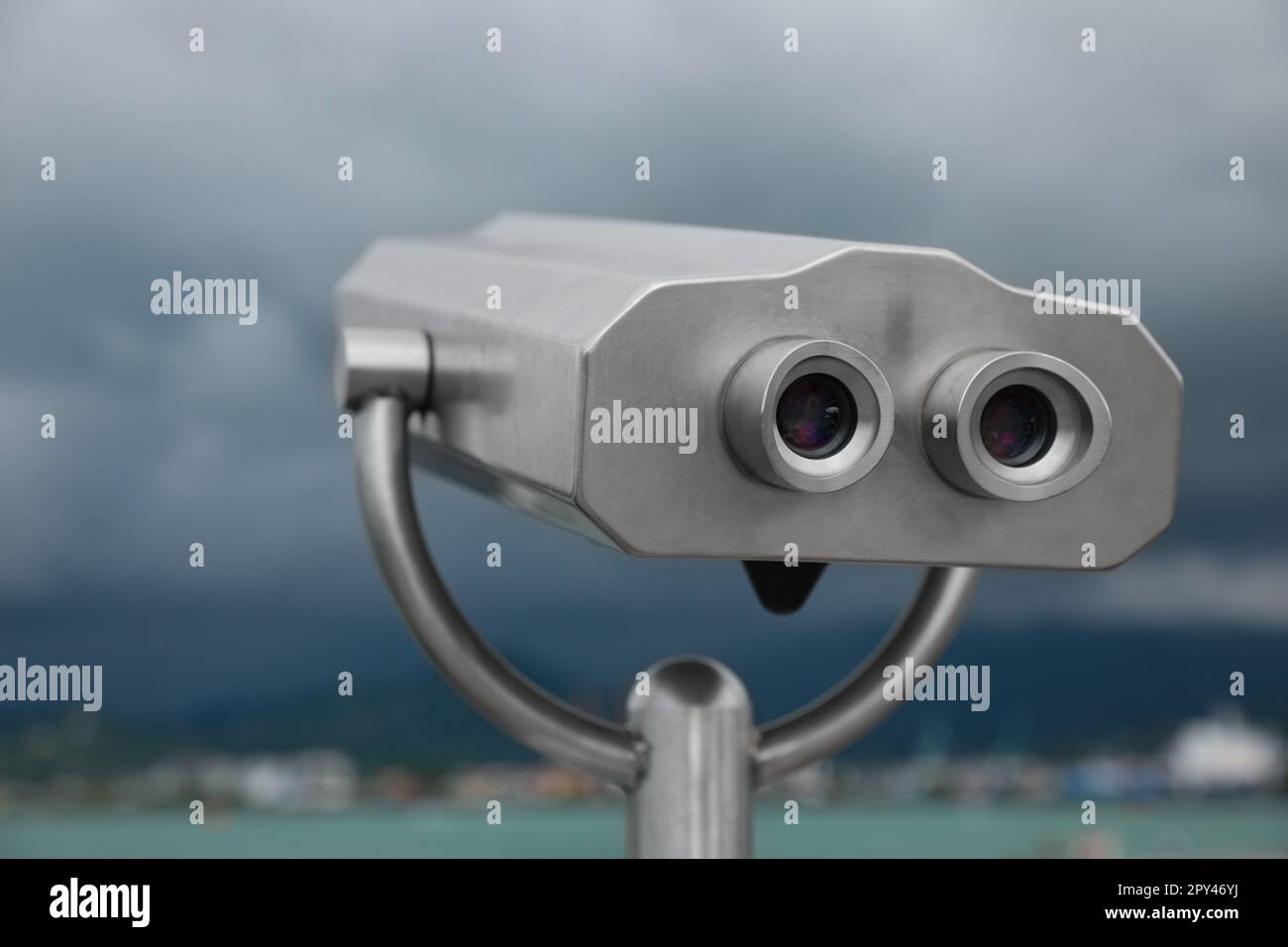 Metal tower viewer installed near sea, closeup. Mounted binoculars ...