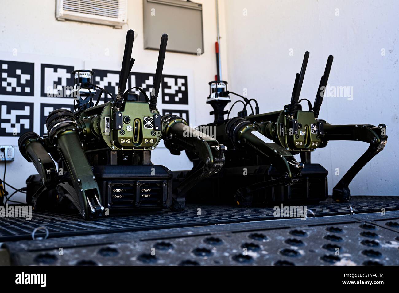 A pair of Vision 60 Q-UGV ground robots charge at their station at ...
