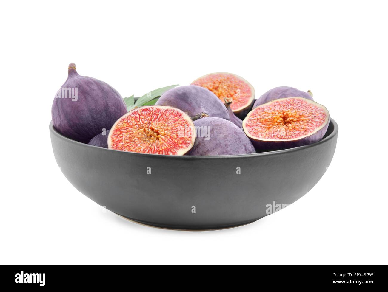 Whole and cut fresh purple figs in bowl isolated on white Stock Photo ...