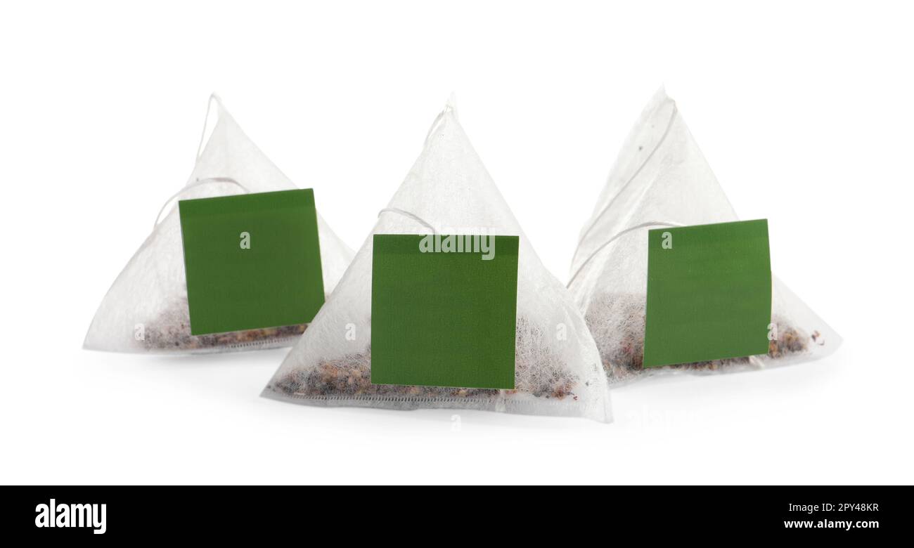 New pyramid tea bags on white background Stock Photo - Alamy