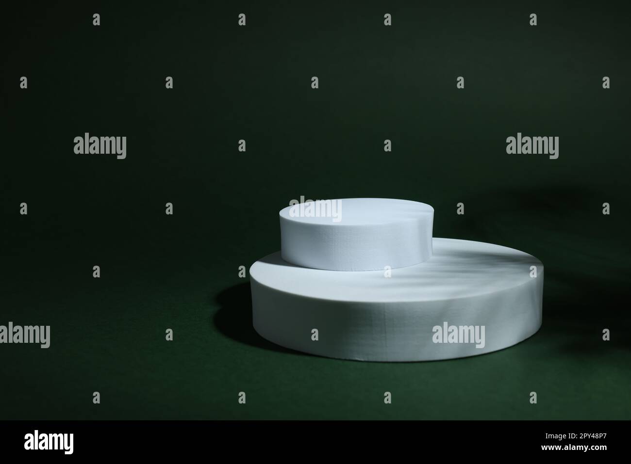 Product photography props. Round shaped podiums on green background ...