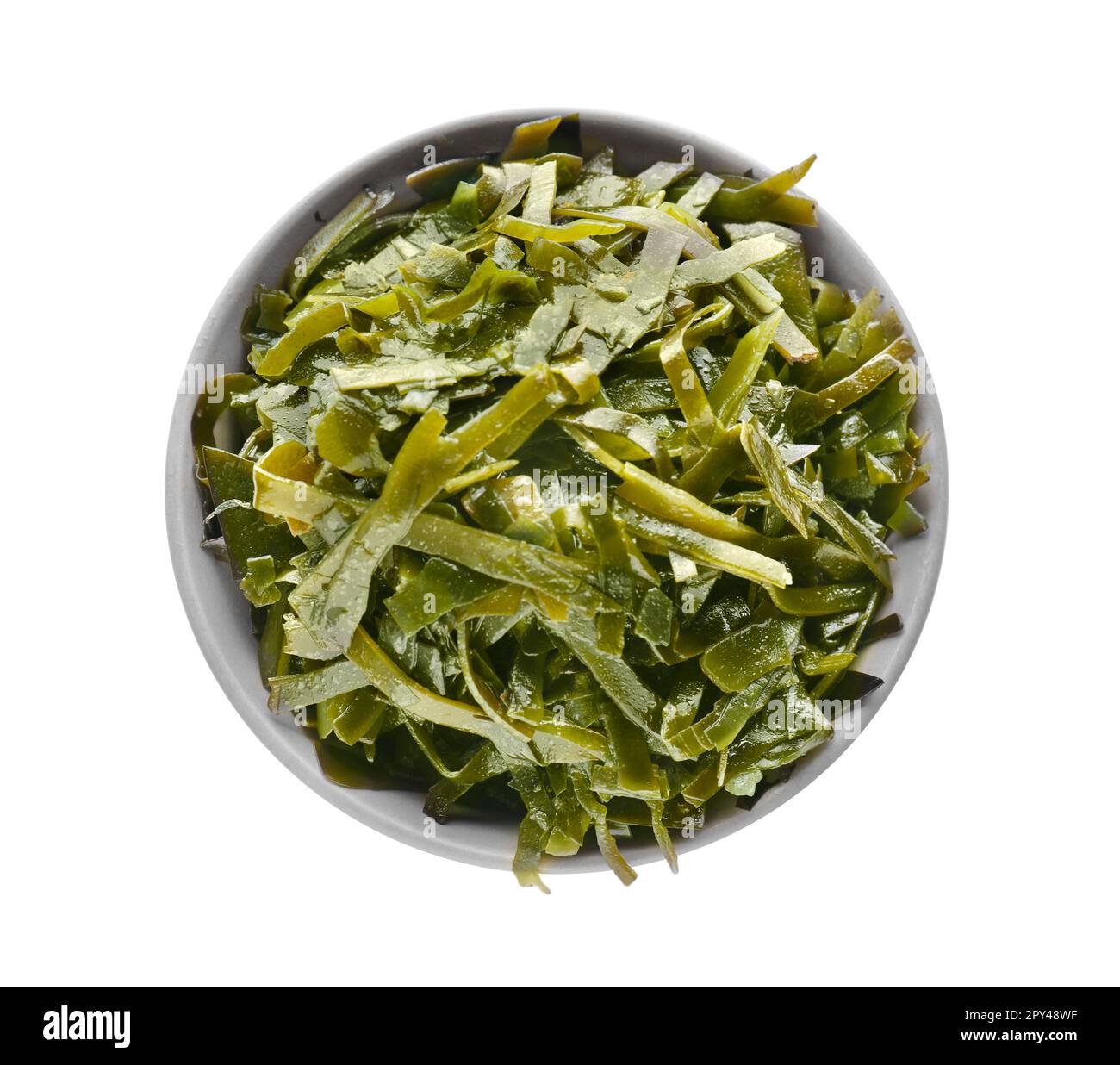 Fresh laminaria (kelp) seaweed in bowl isolated on white, top view Stock Photo - Alamy