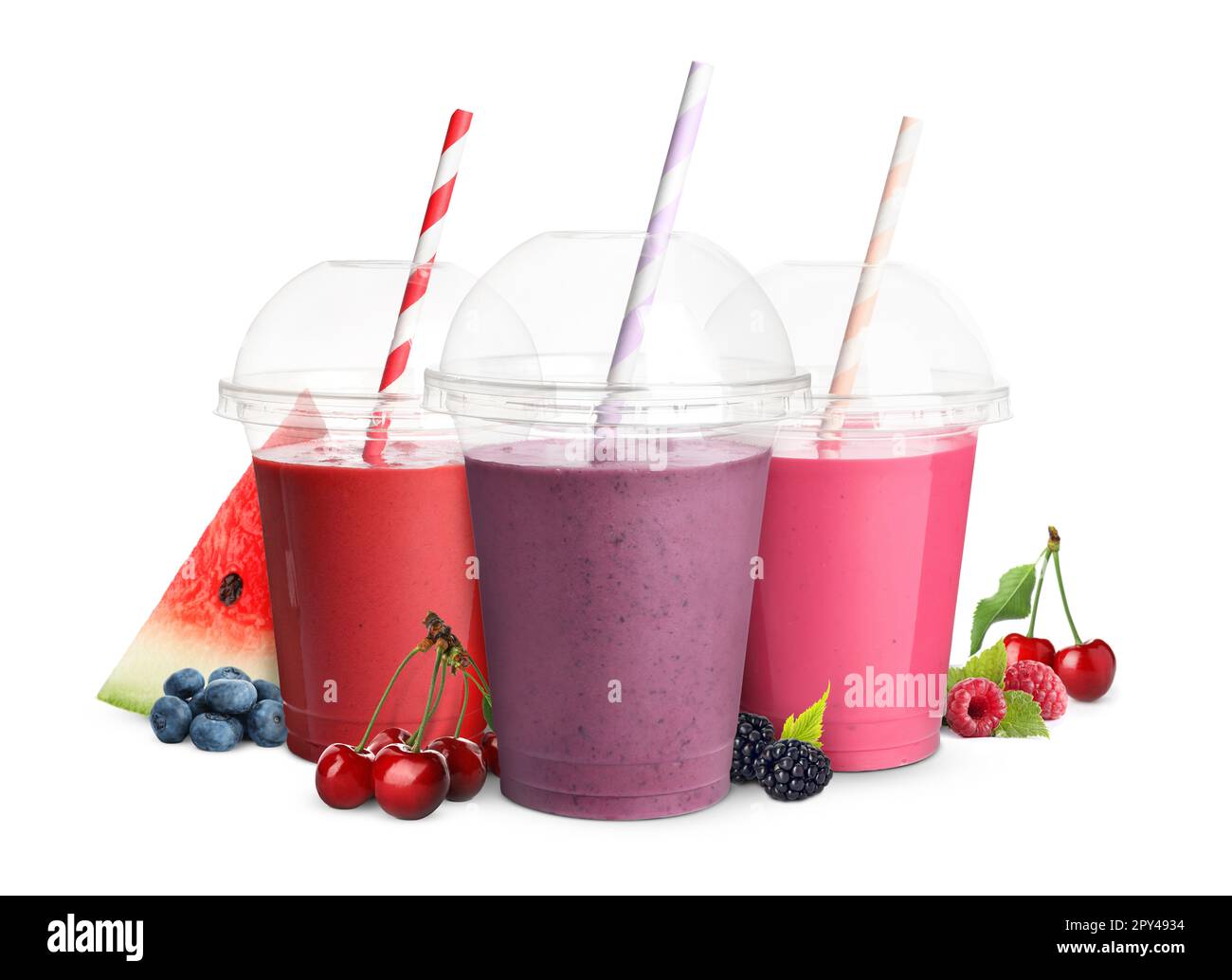Different delicious smoothies in plastic cups on white background Stock ...