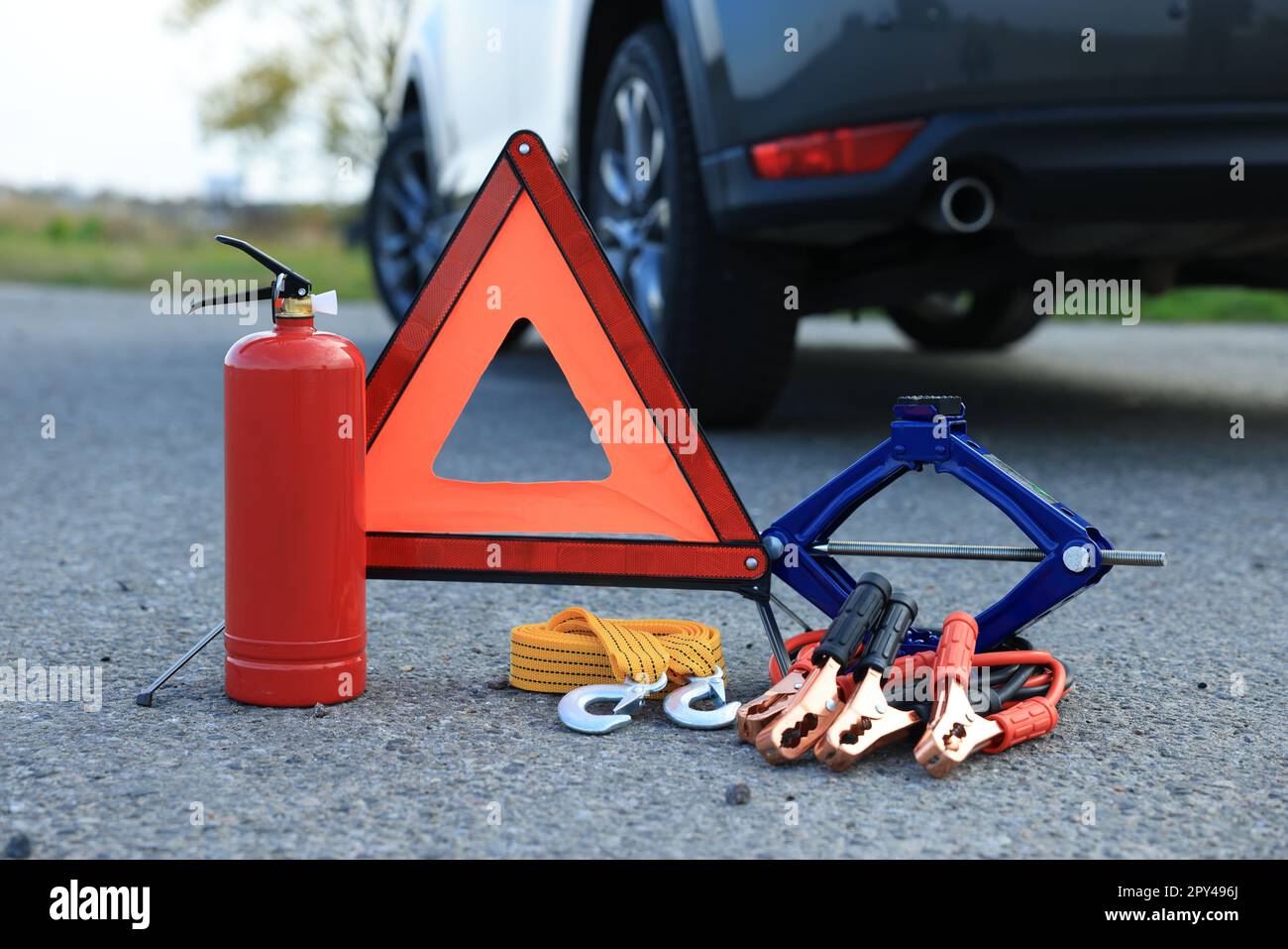 Emergency warning triangle and car safety equipment outdoors Stock ...