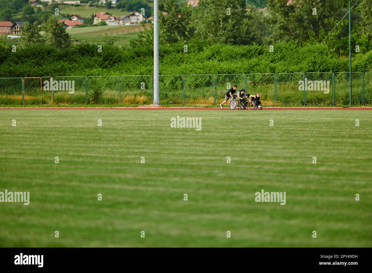 A cameraman filming the participants of the Paralympic race on the ...