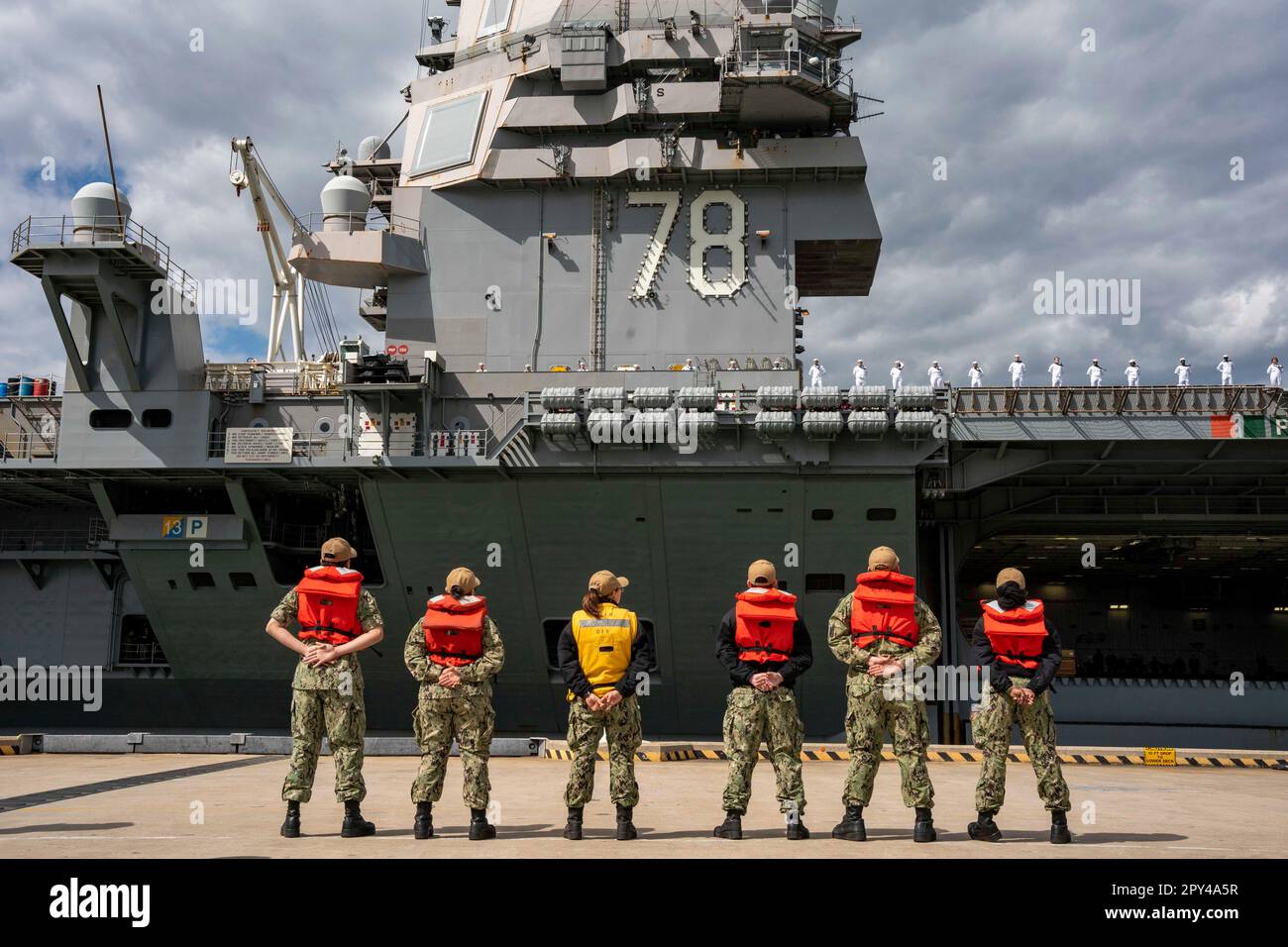 230502-N-QI061-0323 NORFOLK, Va. – Line handlers stand by as the ...