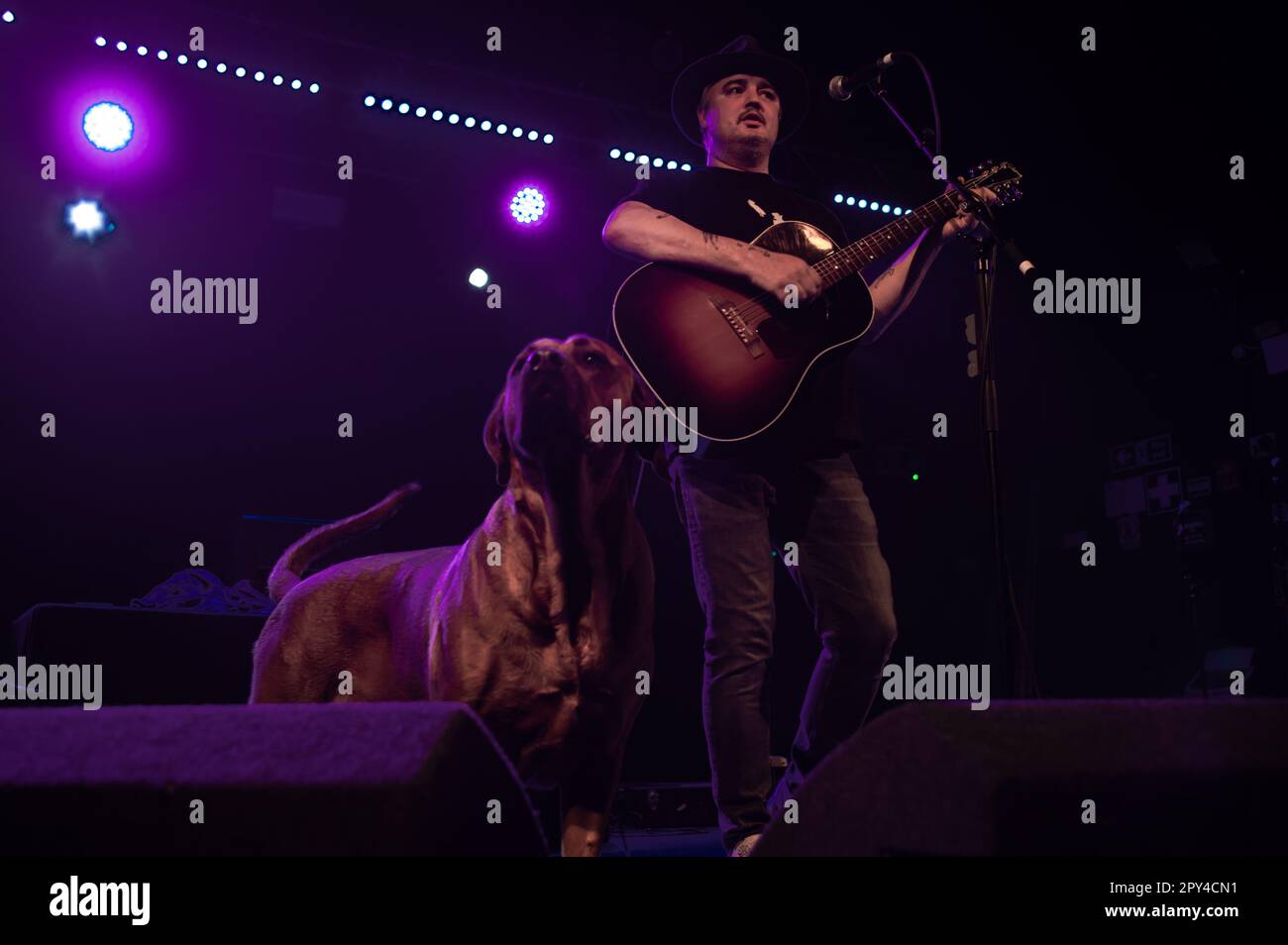London, UK. 2nd May 2023. Peter Doherty on stage with his dog during an ...