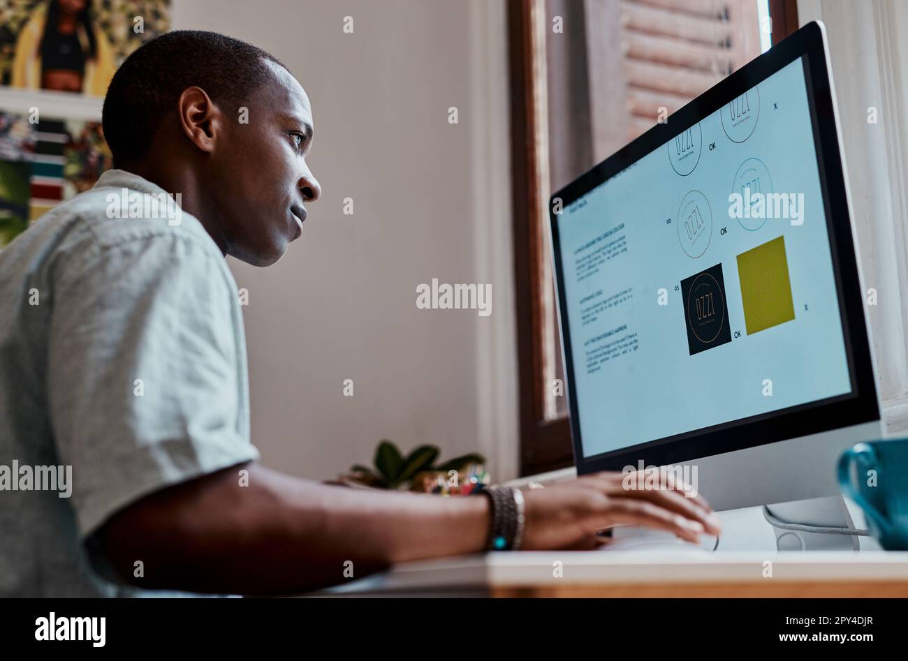 Hard work is his greatest business secret. a young businessman using a ...